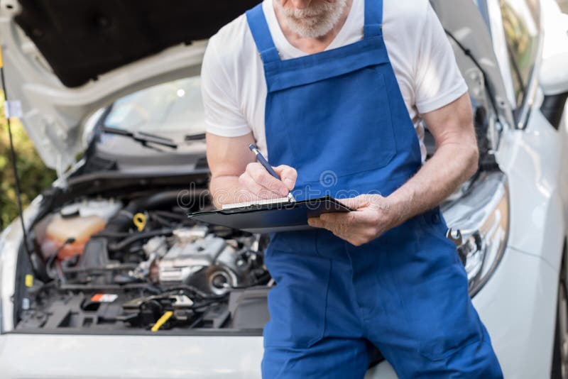 Car Mechanic Checking a Car Engine Stock Image - Image of workshop ...