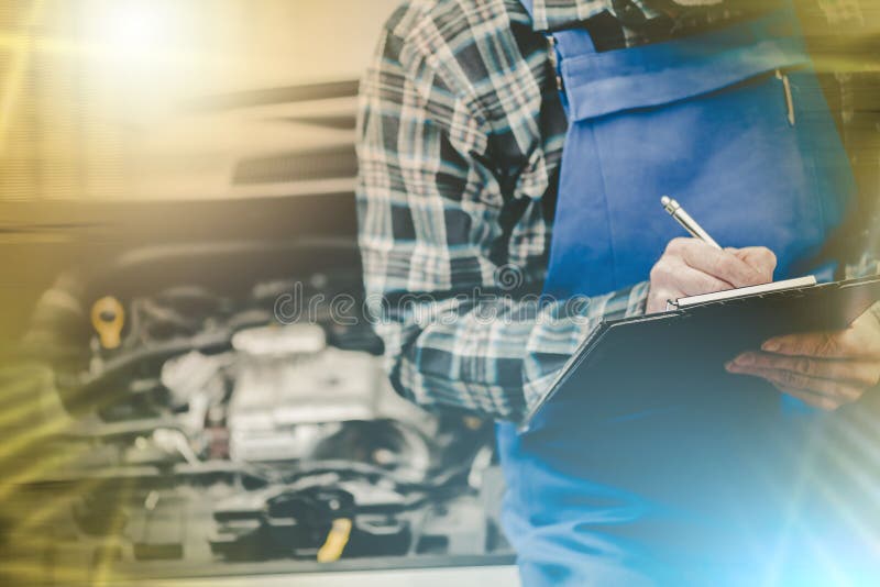 Car Mechanic Checking a Car Engine; Multiple Exposure Stock Photo ...