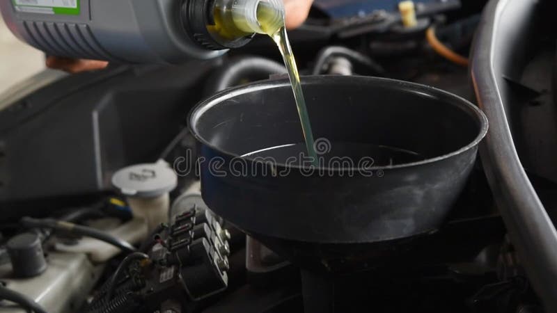Car Mechanic Drain the Old Lubricant Engine Oil Stock Video - Video of ...