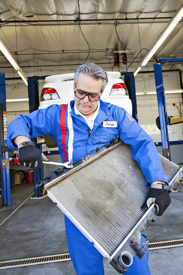 Car Mechanic Fixing Car Auto Part with a Wrench Stock Photo - Image of ...