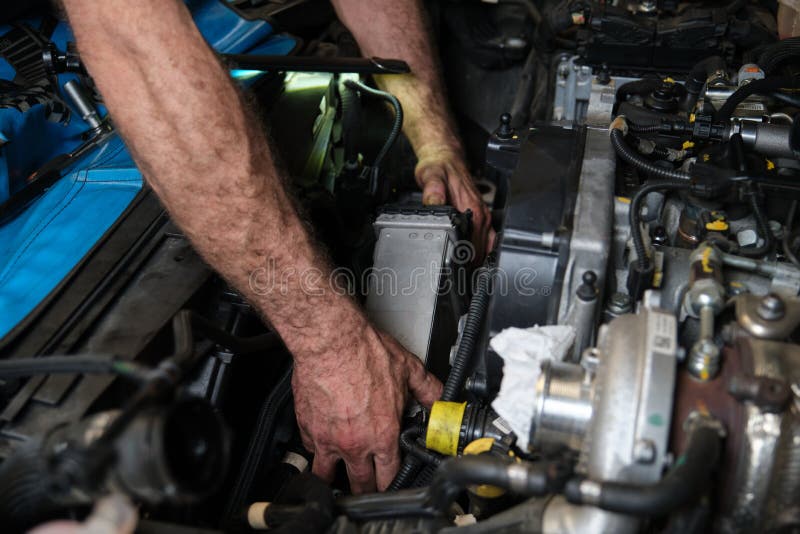 Car Mechanic Hands Replacing Intercooler on a Car Engine. Stock Photo ...