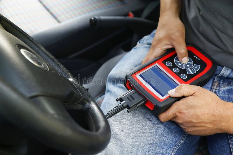Car Mechanic Using an Electronic Device Stock Photo - Image of ...