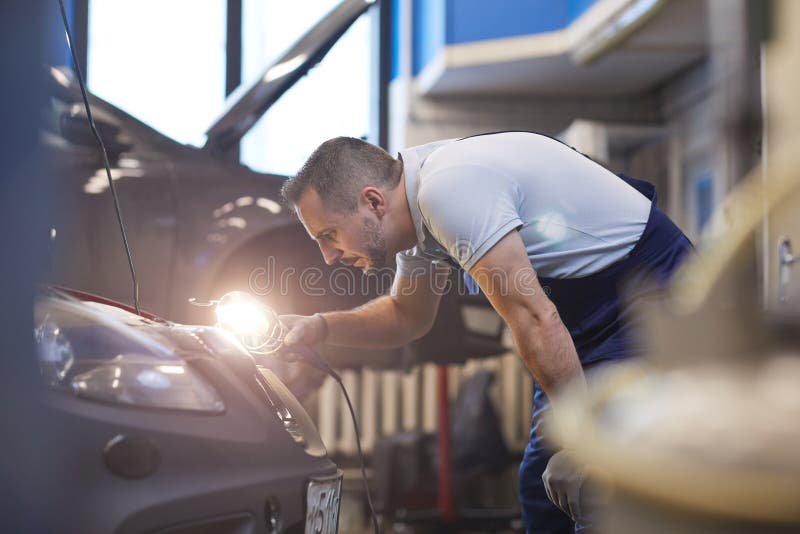 Inspecting Car Flashlight Stock Photos - Free & Royalty-Free Stock ...