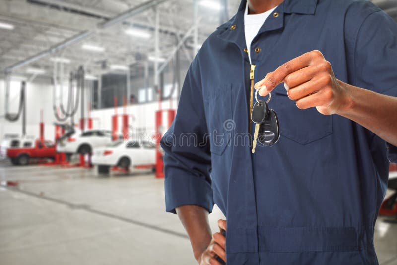 Car mechanic with key. stock photo. Image of male, shop - 79400924