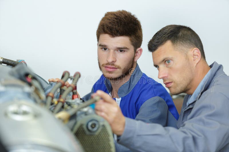 Car Mechanic Man Fixing Engine at Garage Stock Photo - Image of manual ...