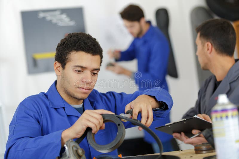 Car Mechanic Man at Garage Fixing Engine Stock Photo - Image of ...