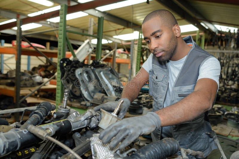 Car Mechanic Man at Garage Fixing Engine Stock Image - Image of ...