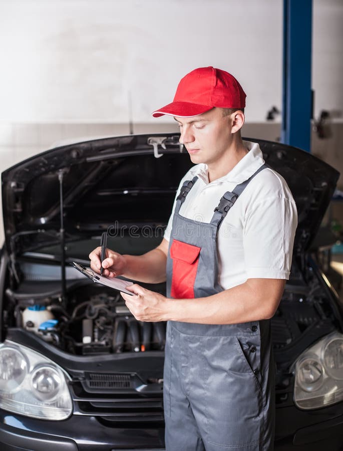 Car Mechanic Preparing Checklist Stock Photo - Image of problem ...