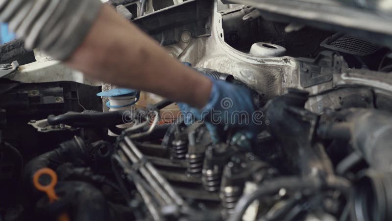Car Mechanic Pulling Back Spark Plugs. Stock Video - Video of engine ...