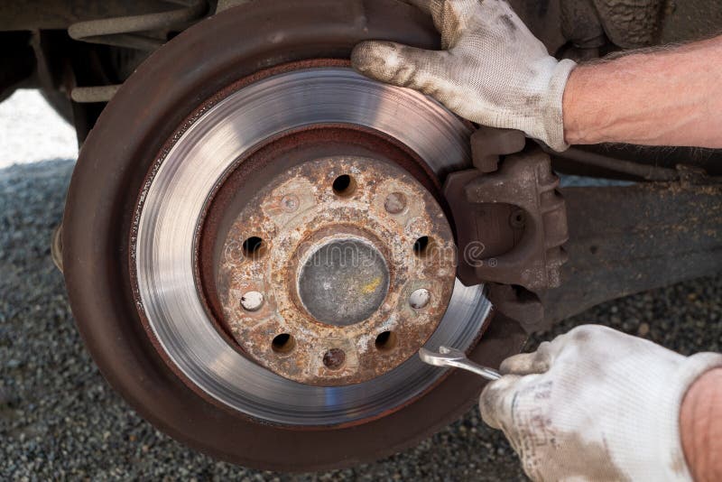 Car Mechanic Repairing Brakes on Car Stock Photo - Image of metal ...