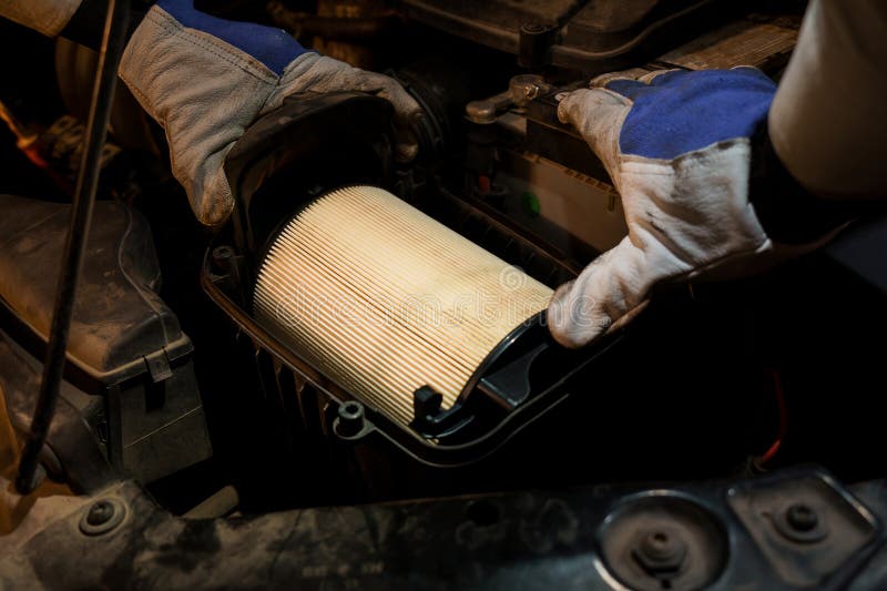 Car Mechanic Replacing Air Filter in Vehicle Engine Stock Photo - Image ...