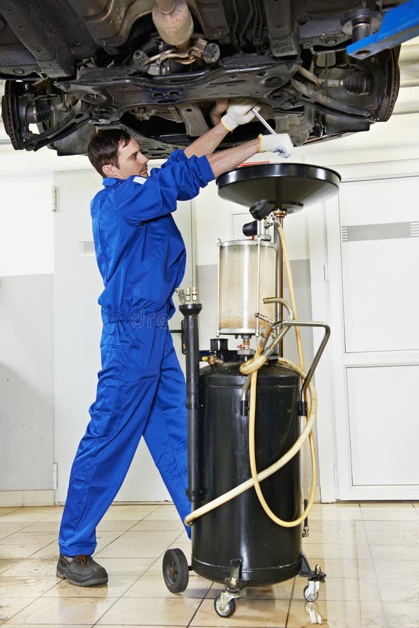 Car Mechanic Replacing Oil from Motor Engine Stock Photo - Image of ...