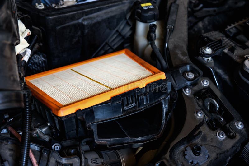 Car Mechanic Replacing Old Paper Air Filter of Car and Installing New ...