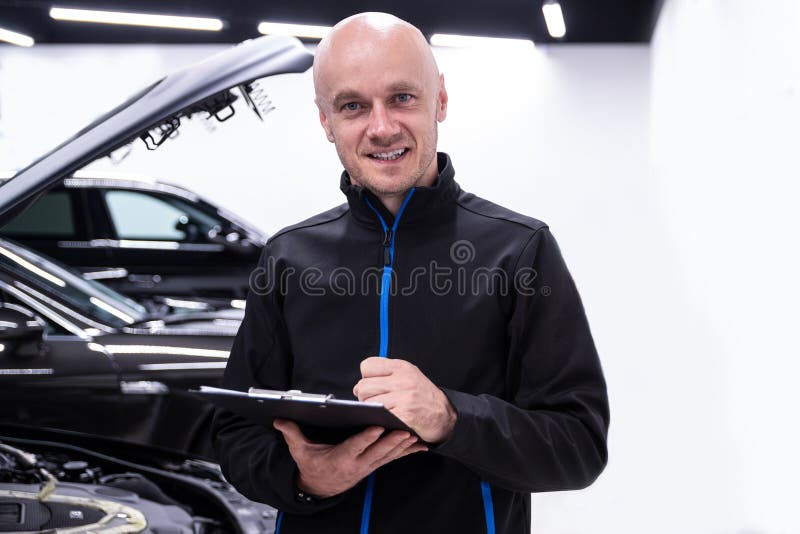 Mechanic or Car Service Owner Checking Car and Filling Documents Stock ...