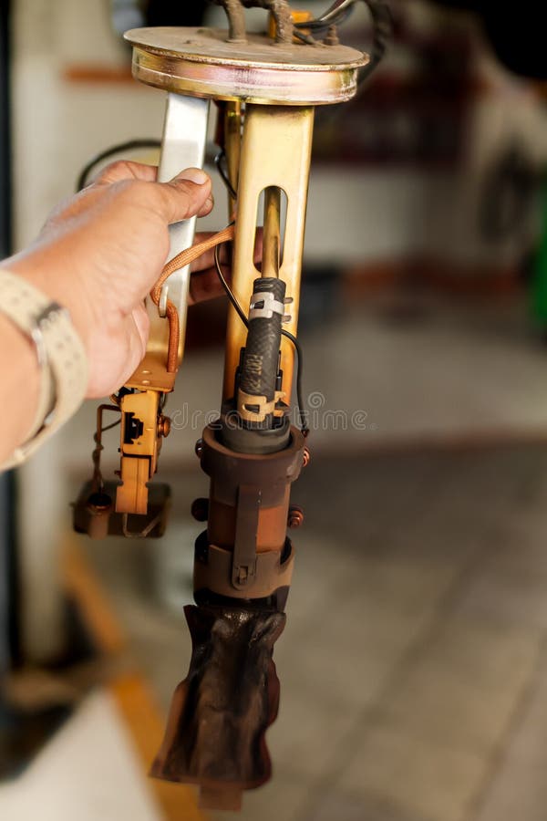 A Car Mechanic Showing Clogged Fuel Filter Assembly Stock Photo - Image ...