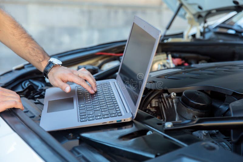 Car Mechanic Using a Computer Laptop Stock Photo - Image of computer ...