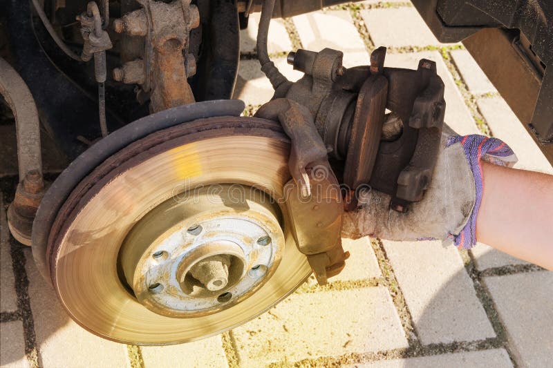 Car Mechanic Using Different Repair Tools for Repairing a Car ...