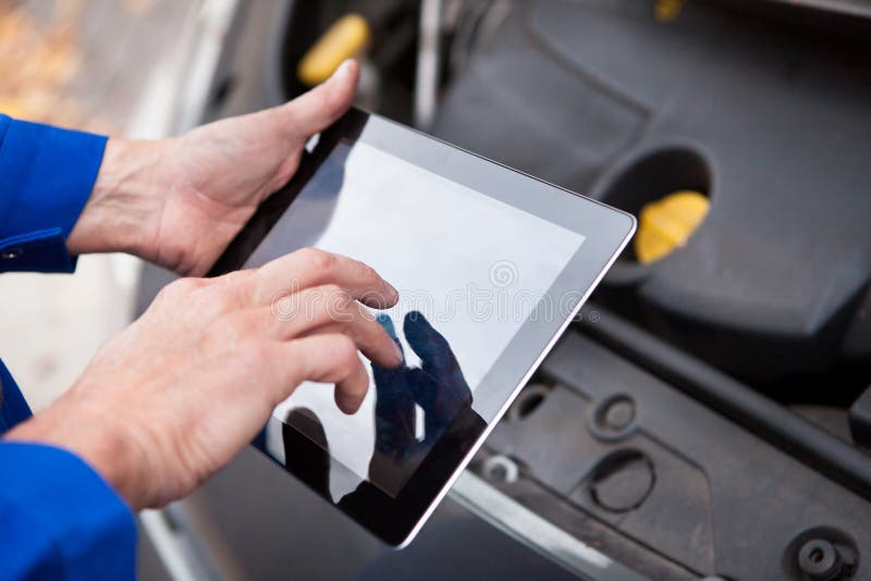 Using Tablet Computer in Auto Shop Stock Photo - Image of ...