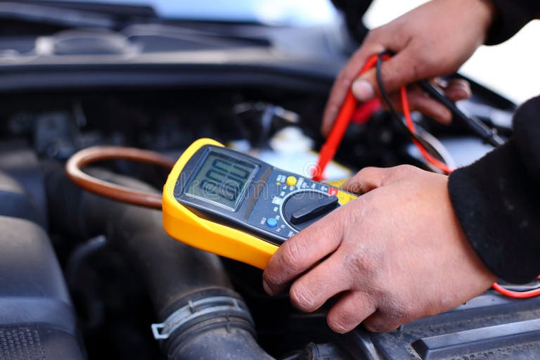 Car Mechanic Using an Electronic Device Stock Photo - Image of ...
