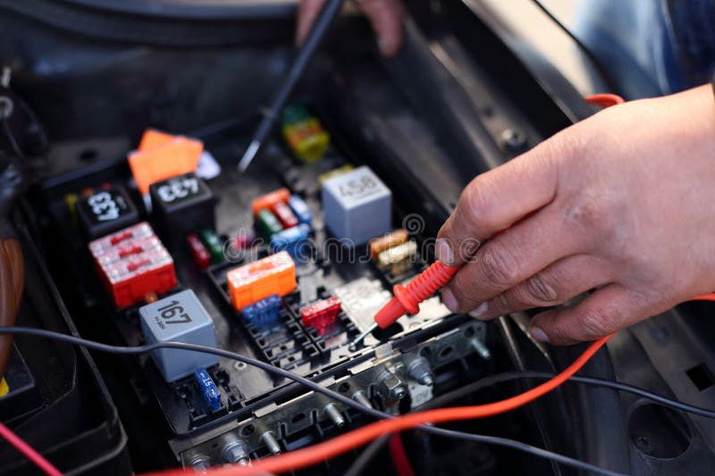 Car Mechanic Using an Electronic Device Stock Photo - Image of current ...