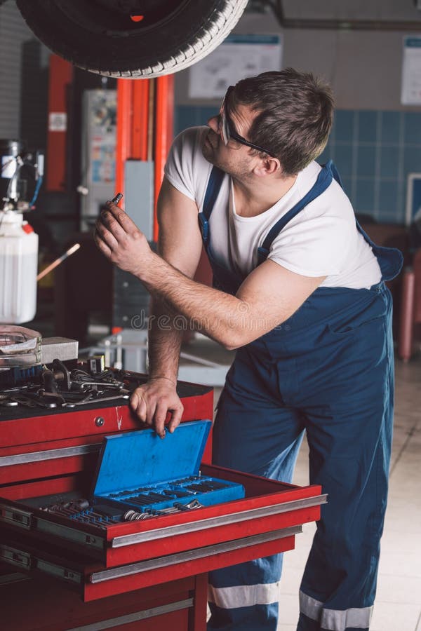 Car Mechanic Working in Auto Repair Service Stock Photo - Image of ...