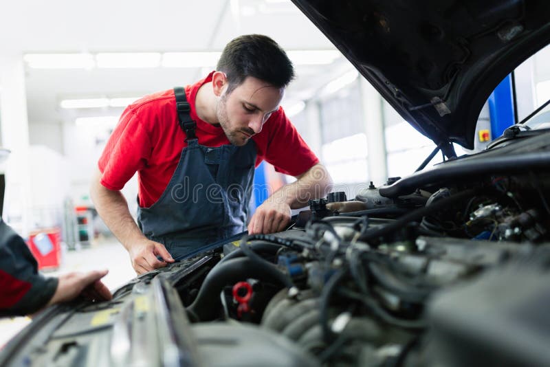 Car Mechanic Working at Automotive Service Center Stock Image - Image ...