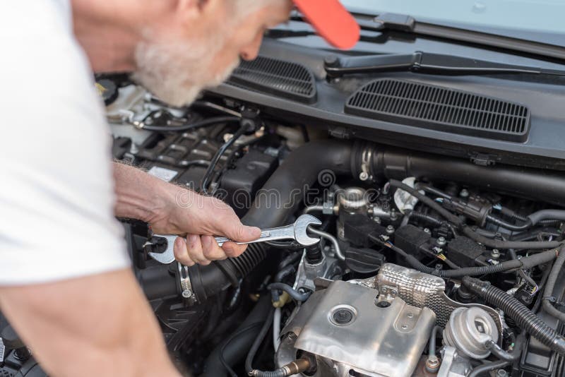 Car Mechanic Working on Car Engine Stock Photo - Image of auto, vehicle ...