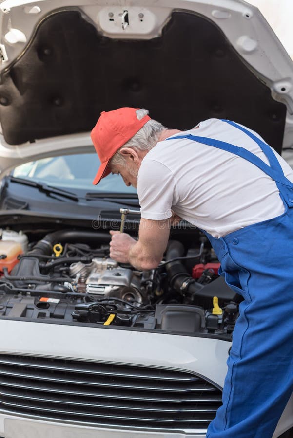 Car Mechanic Working on Car Engine Stock Photo - Image of working ...