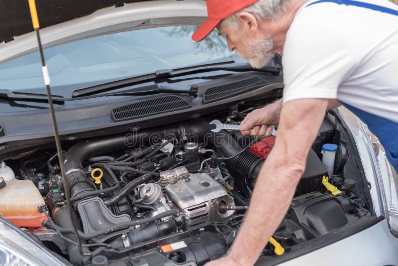 Car Mechanic Working on Car Engine Stock Photo - Image of worker ...