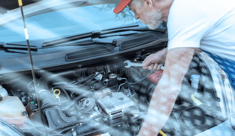 Car Mechanic Working on Car Engine; Light Effect Stock Image - Image of ...