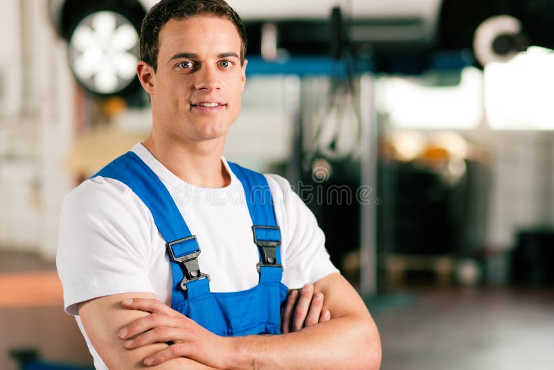 Car mechanic in workshop stock photo. Image of lift, male - 15749656