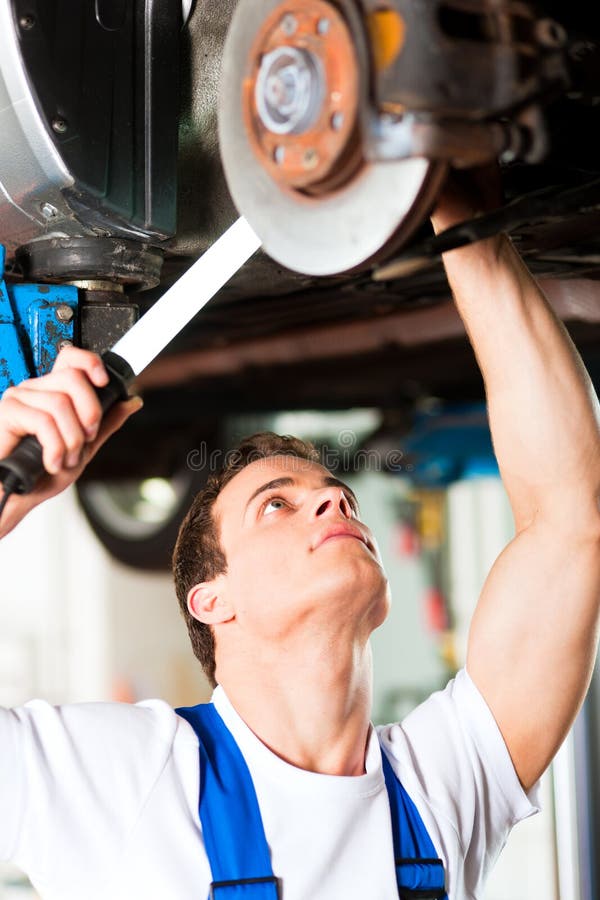 Car mechanic in workshop stock photo. Image of profession - 15749640