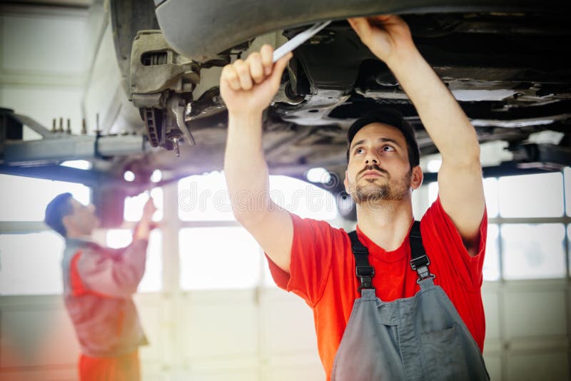 Car Mechanics Working and Maintaining Car Stock Image - Image of ...