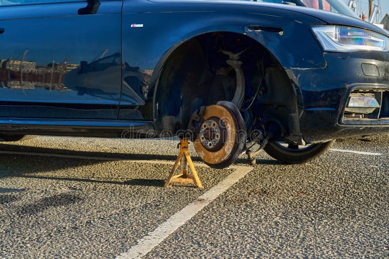 A car is missing a wheel stock image. Image of driving - 241225327