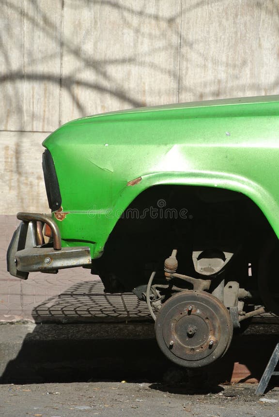 Car missing a wheel stock image. Image of green, transportation - 32777175
