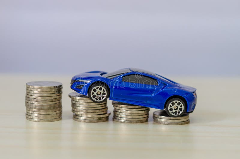 Car Model on Stacks of Coin Stock Photo - Image of bank, management ...
