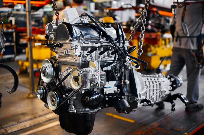 Car Motor Hangs on Chains in Assembling Plant Workshop Stock Image ...