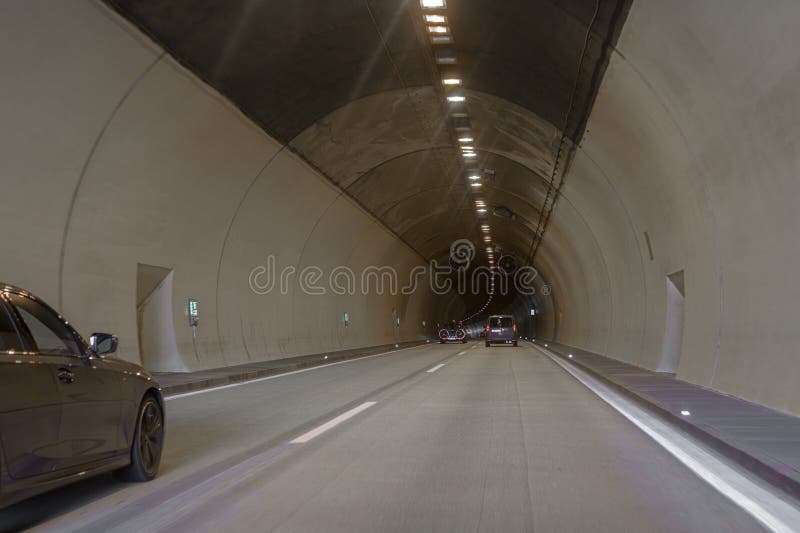 A Car on a Motorway in a Tunnel Drives Along the Road Stock Photo ...