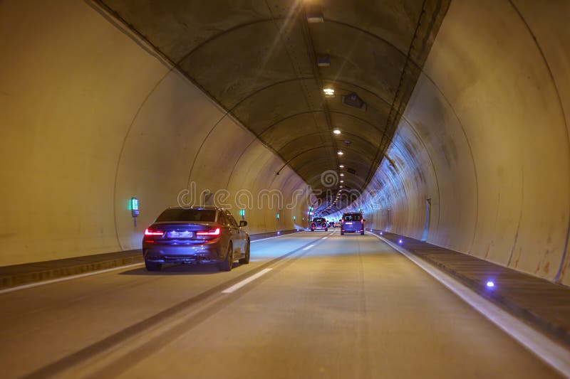A Car on a Motorway in a Tunnel Drives Along the Road Stock Image ...