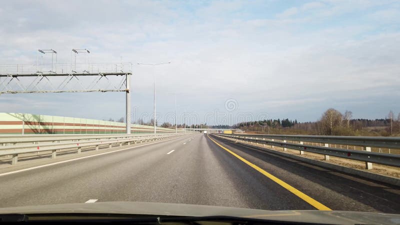 The Car Moves on an Asphalt Highway. Front View through the Windshield ...