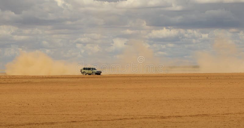Car moving on a desert stock footage. Video of long - 180216018