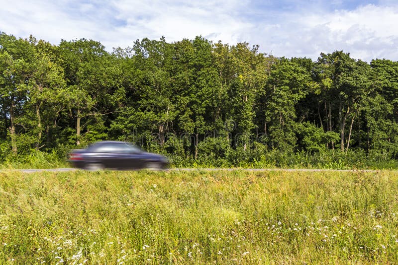 The car is moving quickly stock image. Image of cloudscape - 82266039