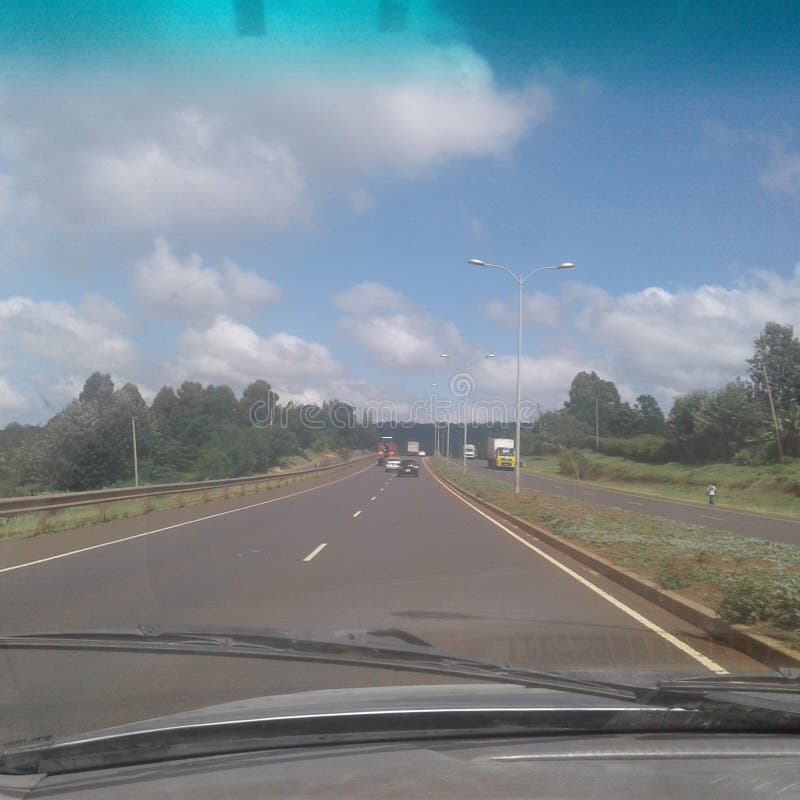 Car Moving on Straight Perspective Road ,white Clouds Stock Image ...