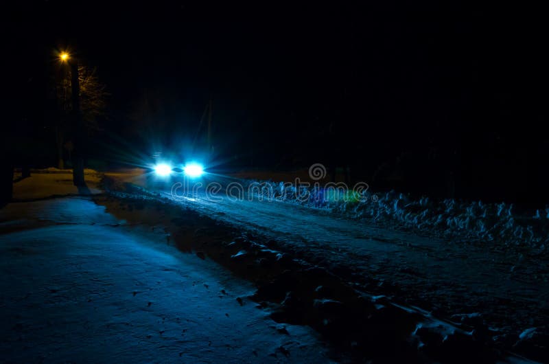 Car at Night on the Snow-covered Road Stock Photo - Image of city ...