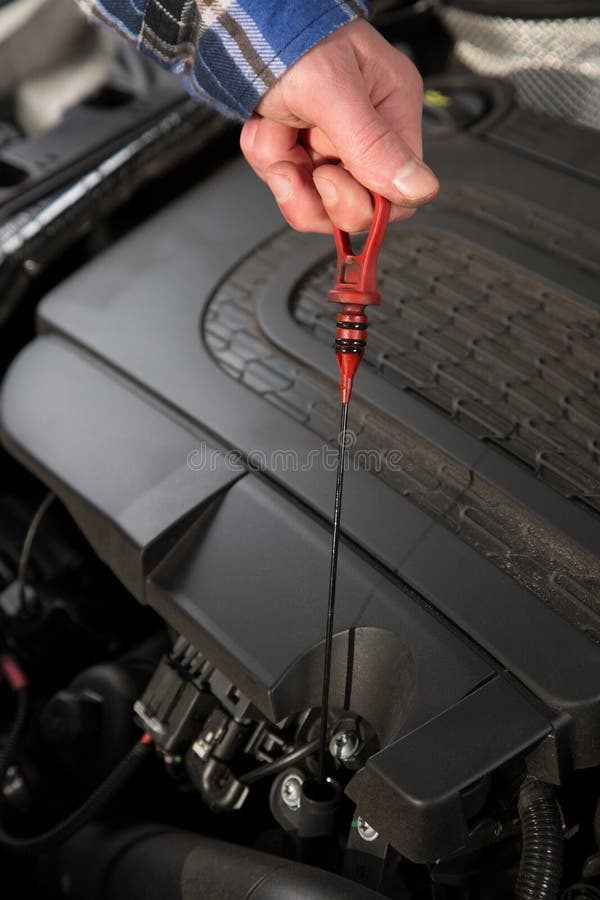 Car oil stick verification stock photo. Image of hood - 52487774