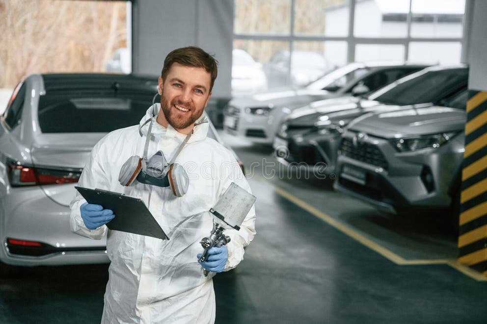 Car Painter is Standing in the Garage with Documents in Hands Stock Image - Image of business ...