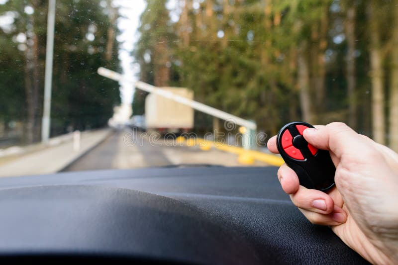Car Park Automatic Entry System. Man with Remote Control Opens B Stock ...