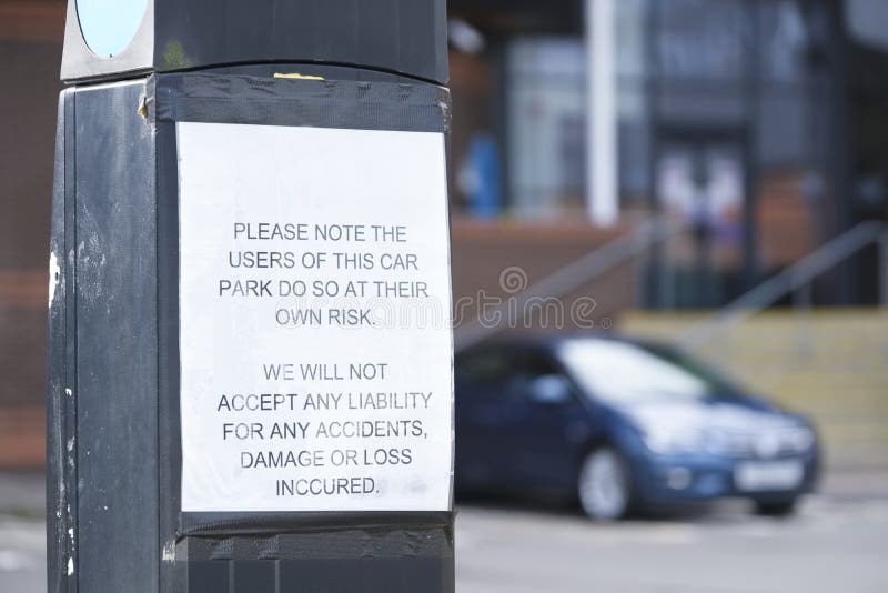 Car Park Users Do so at Own Risk Sign Stock Photo - Image of driver ...
