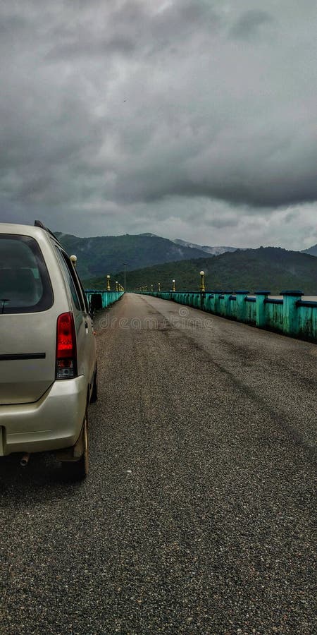 Car parked on a dam road stock image. Image of automotive - 194107797