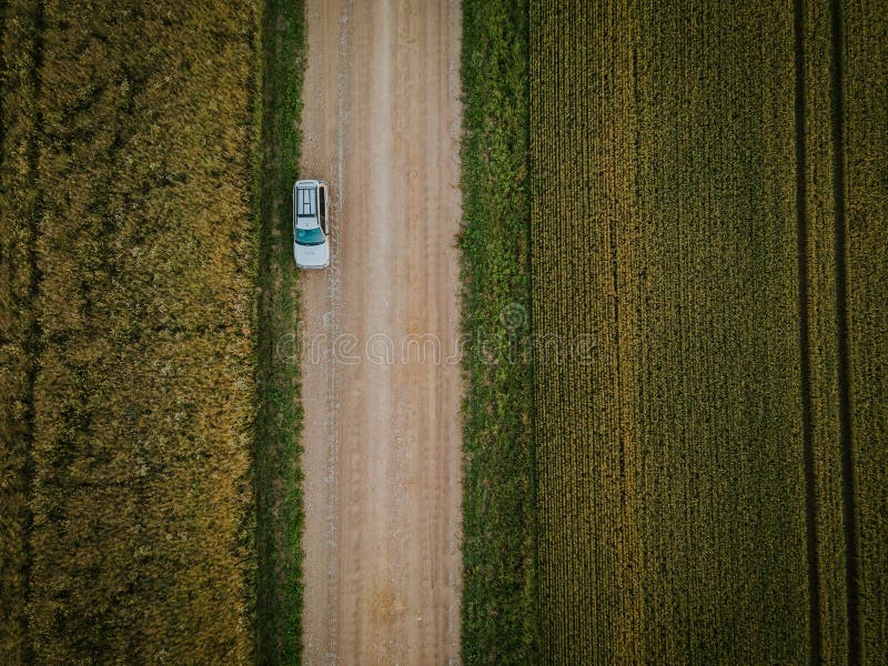 Car Parked on Dirt Road with Crop Fields Surrounded Stock Image - Image ...
